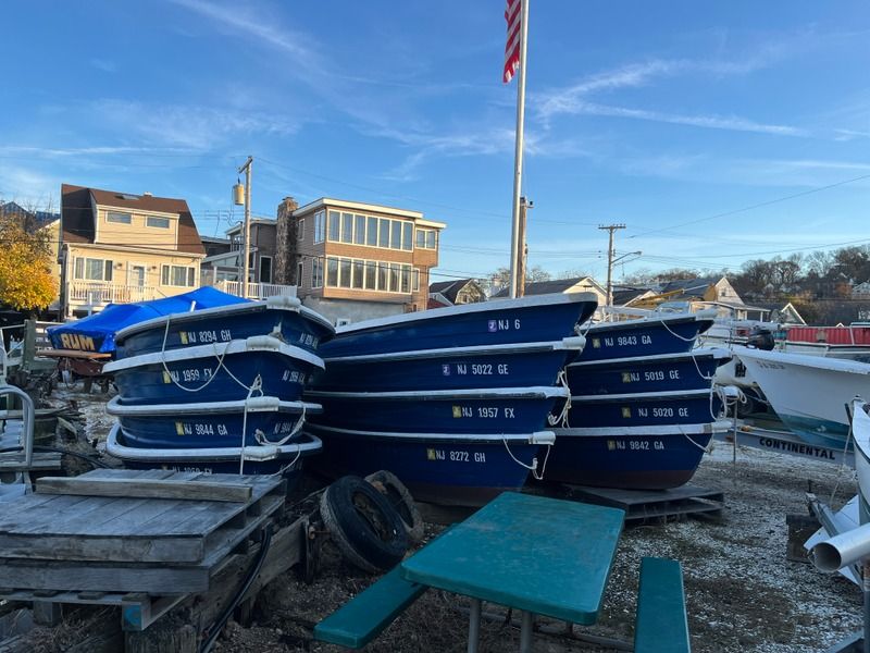 (12) 15′ Henrique Fiberglass Skiffs w/15HP Suzuki 4 Stroke Out Boards ...